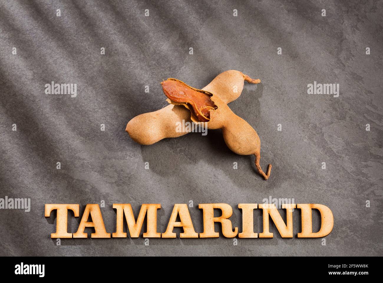 Tamarind tropical fruit - Tamarindus indica. Text space Stock Photo - Alamy