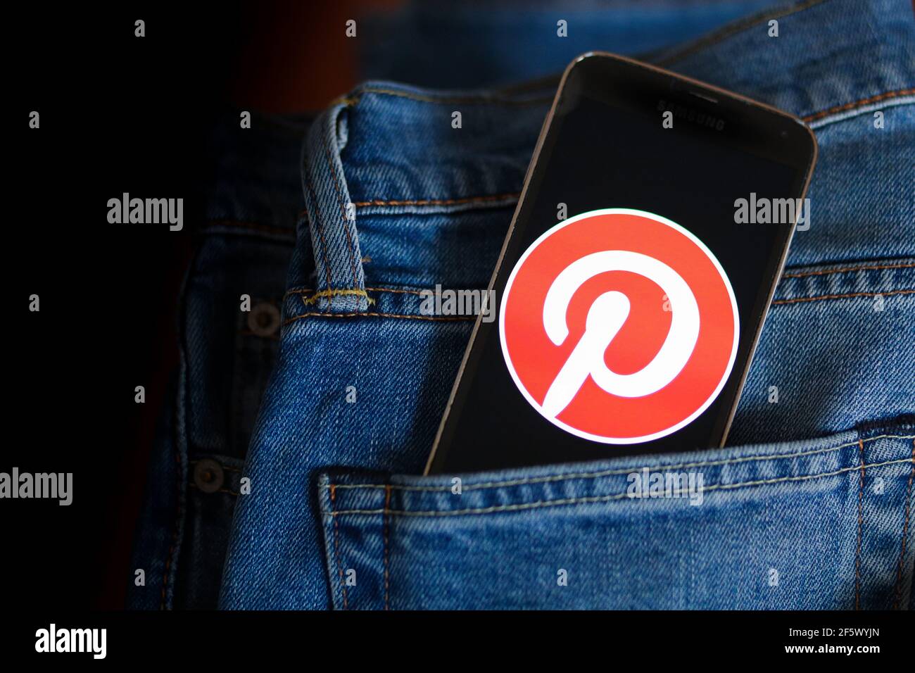 In this photo illustration a Pinterest logo seen displayed on a ...