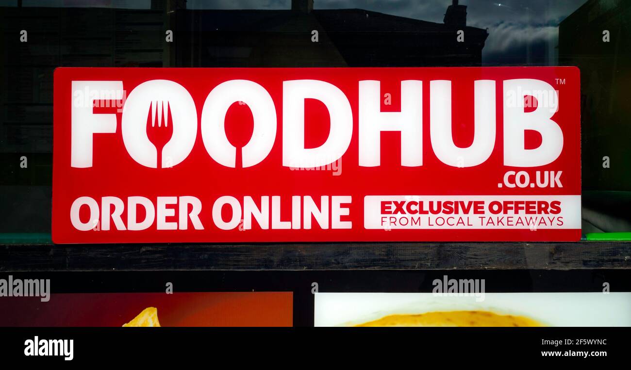 Sign for FoodHub on a take away food shop FoodHub provides an on-line ...