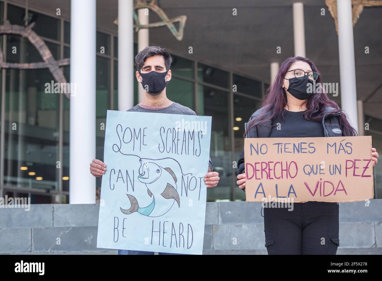 Barcelona, Spain. 28th Mar, 2021. Activists holding placards expressing ...