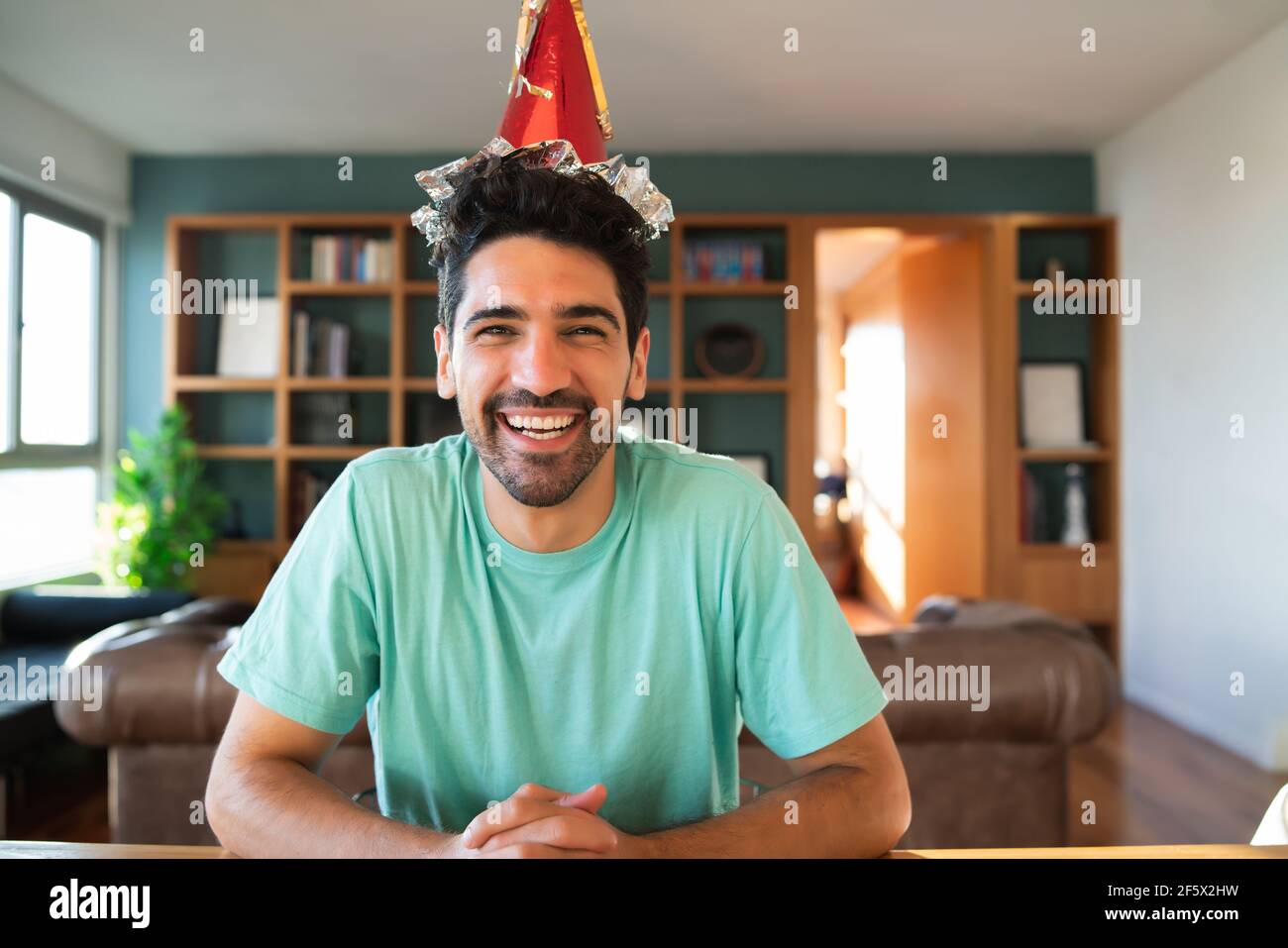 Man celebrating his birthday on a video call Stock Photo - Alamy