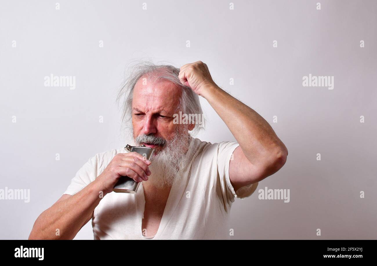 An American alcoholic male drinking booze from hip flask Stock Photo ...