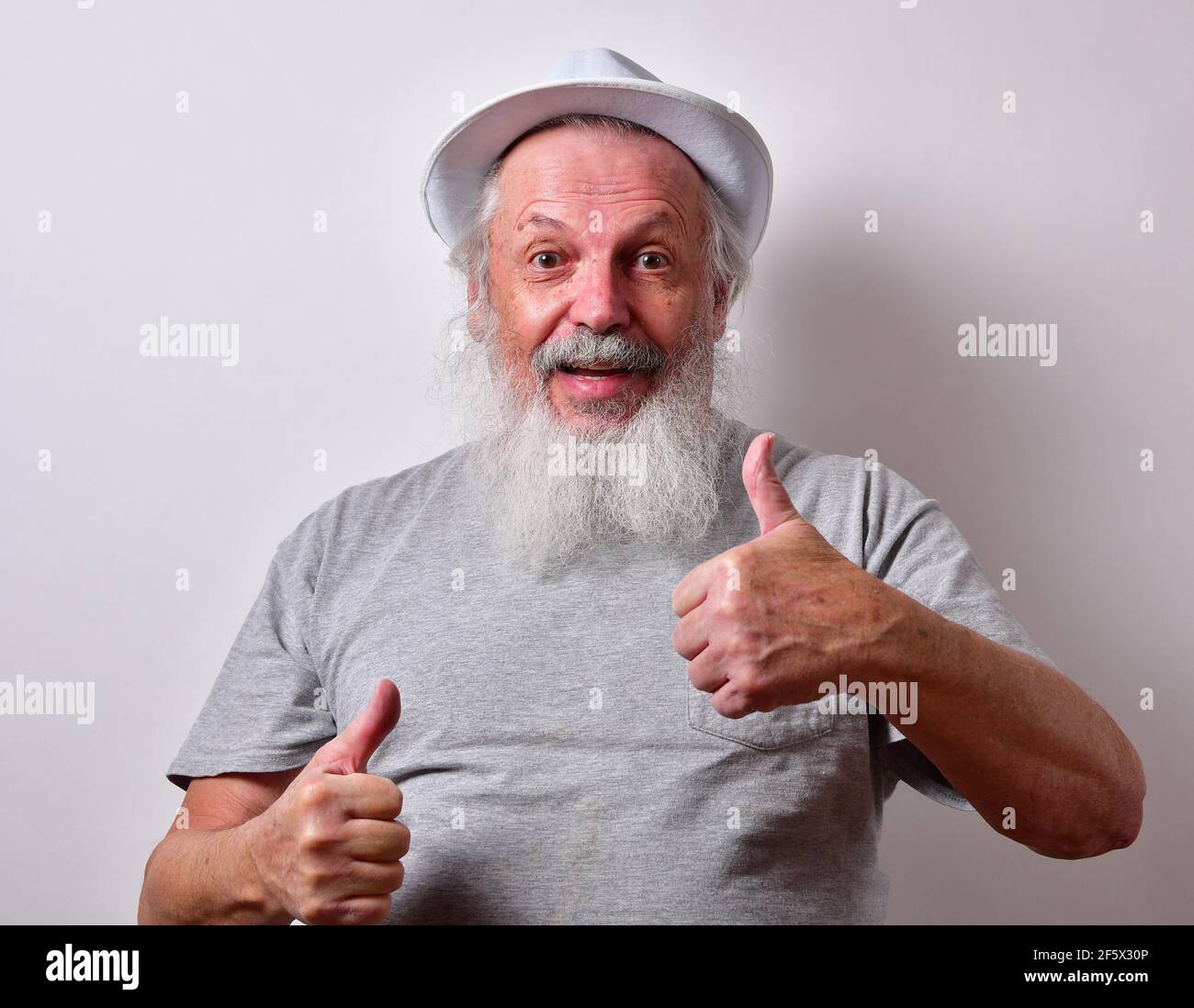 An American male wearing a red fedora showing double thumbs up Stock ...