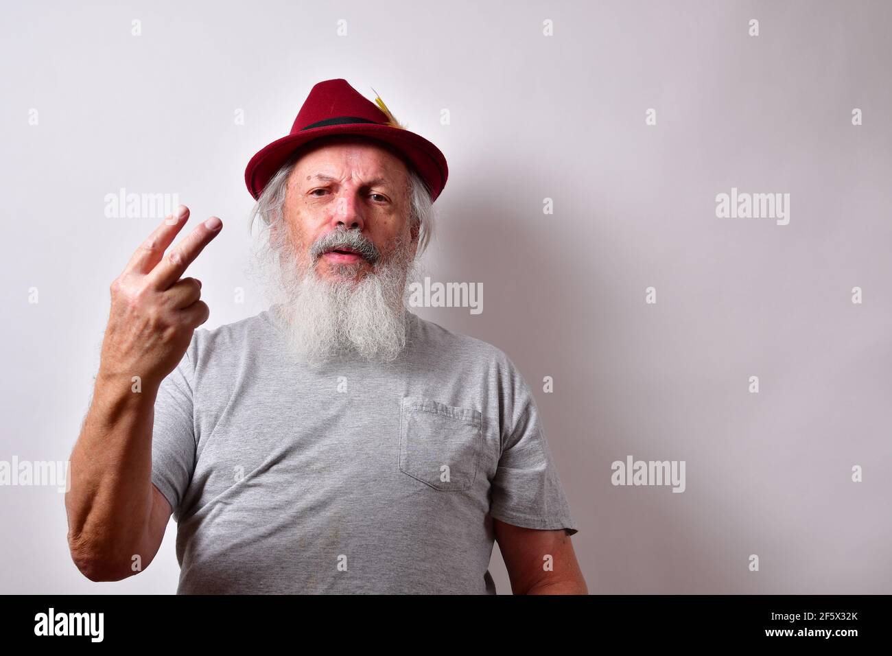 An American male wearing a red fedora showing victory sign Stock Photo ...