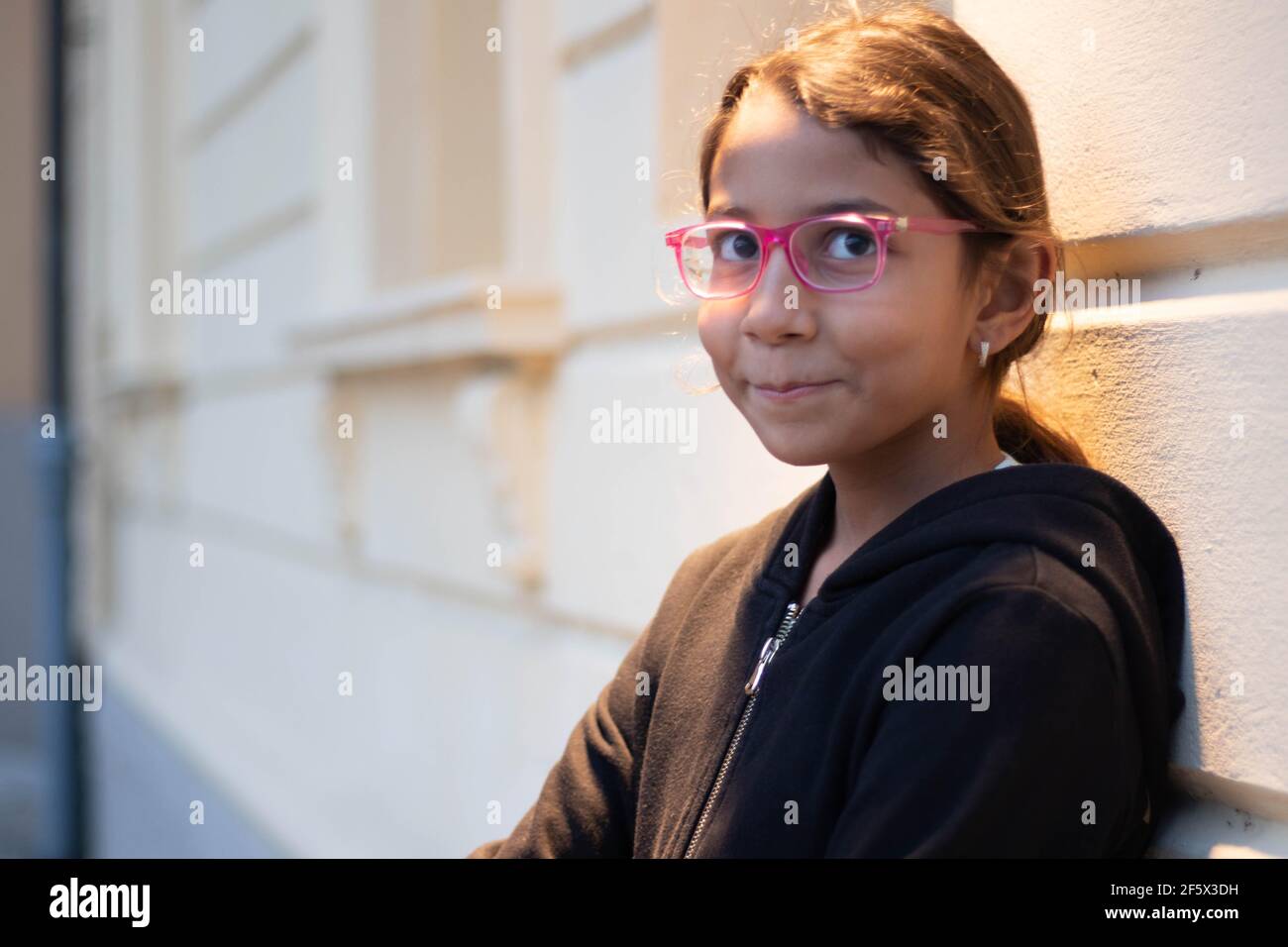 Brunette girl portrait with glasses unfocused background Stock Photo ...