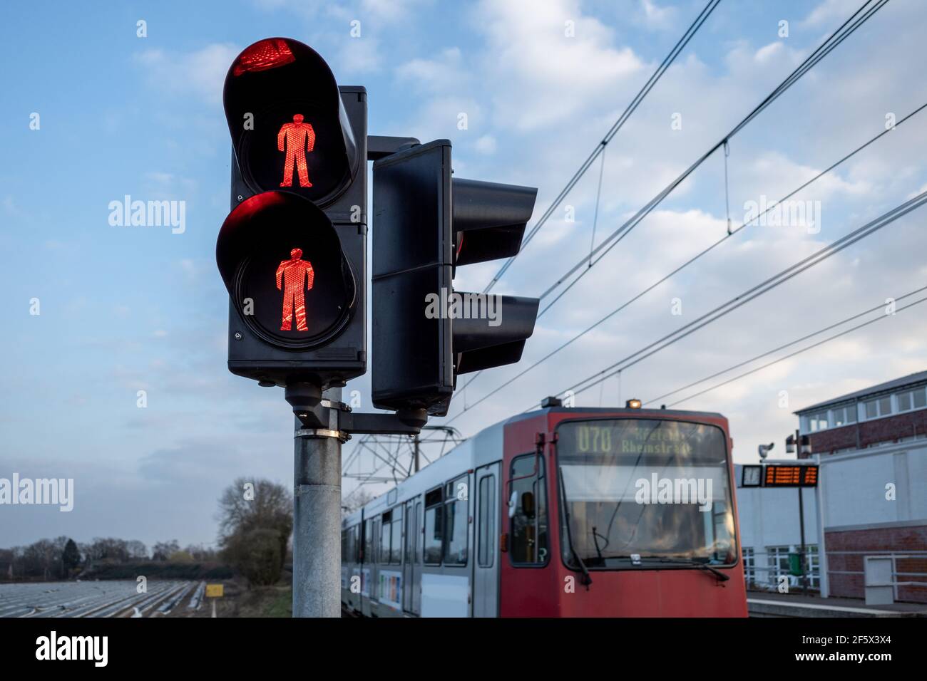 Low angle view, traffic light with red human symbol to stop walking ...