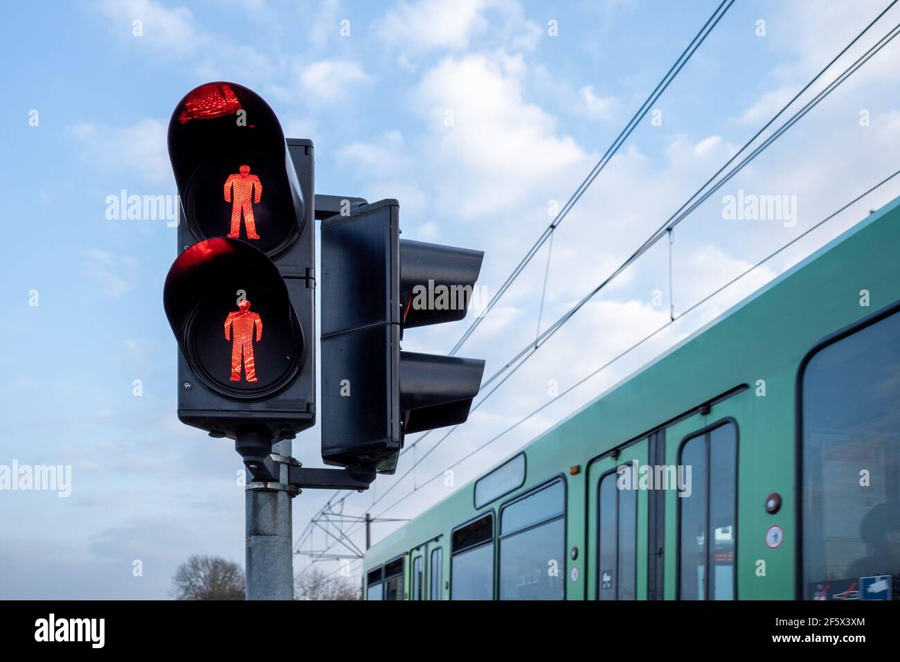 Low angle view, traffic light with red human symbol to stop walking ...