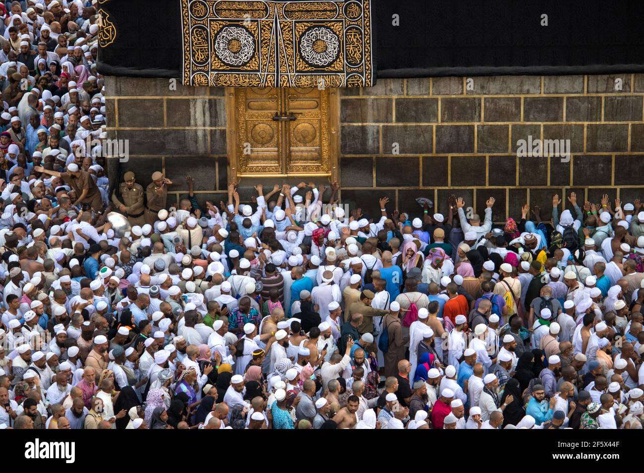 Holy Kaaba. The door of the Kaaba - Multazam. Muslim pilgrims from all ...