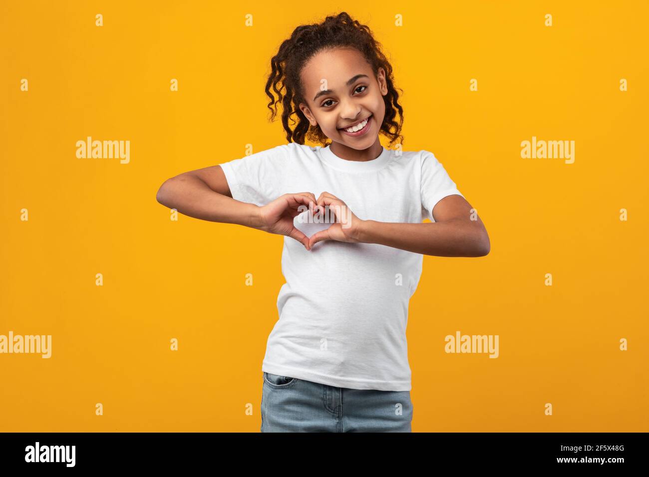 Girl doing hands heart hi-res stock photography and images - Alamy