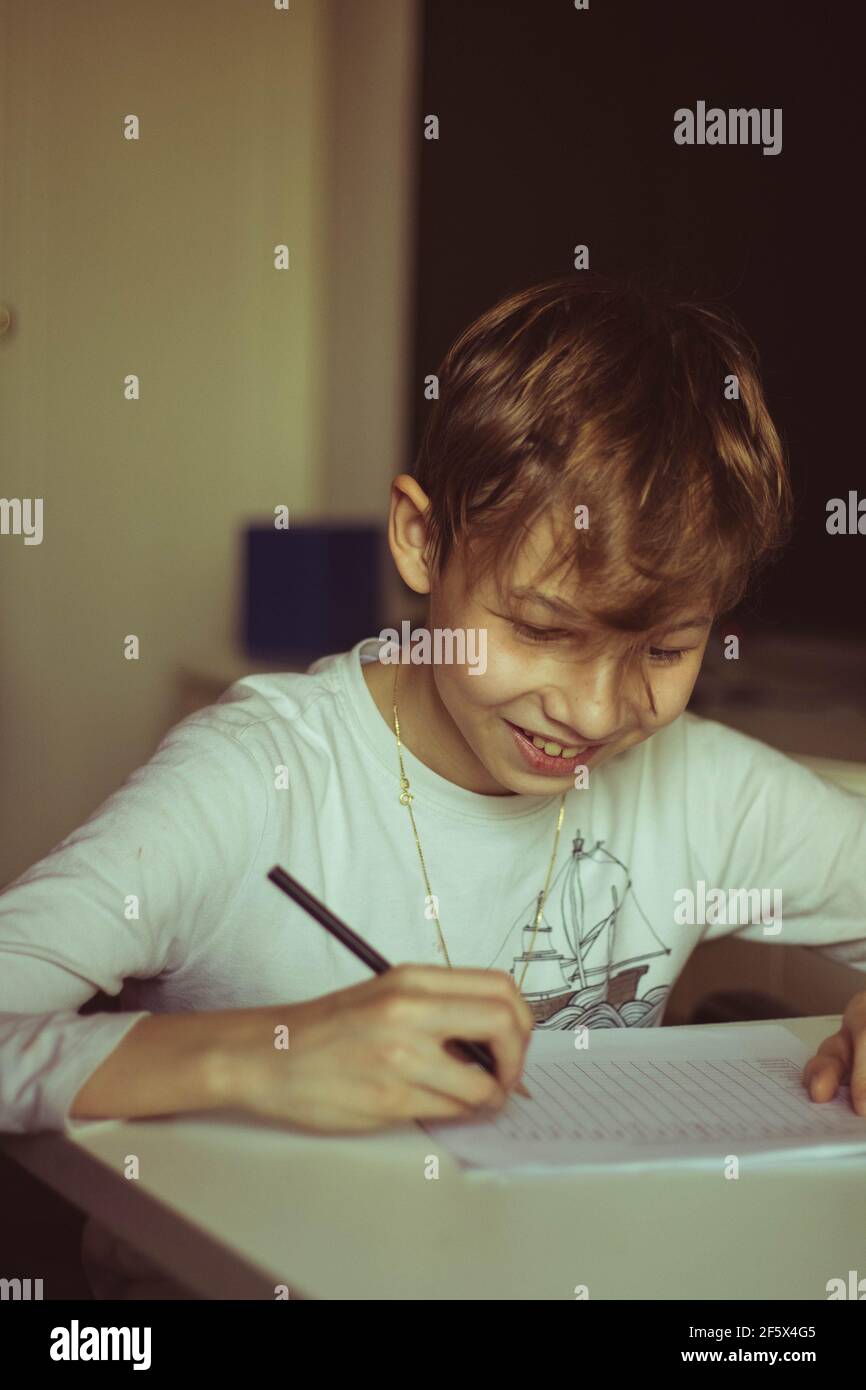 Child doing homework in Italy 2021 Stock Photo - Alamy