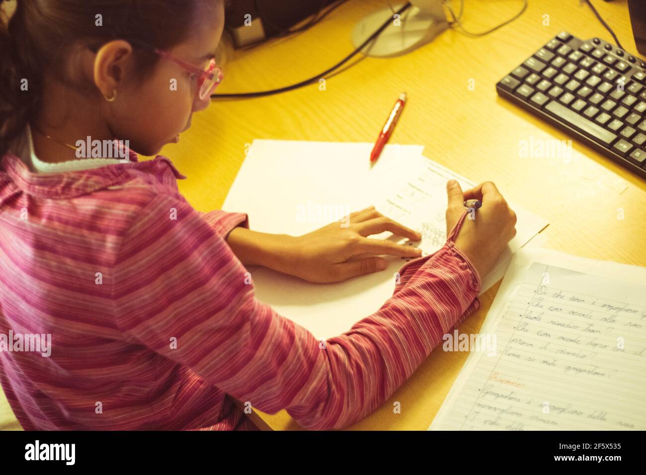 Girl doing homework in italy 2021 Stock Photo - Alamy