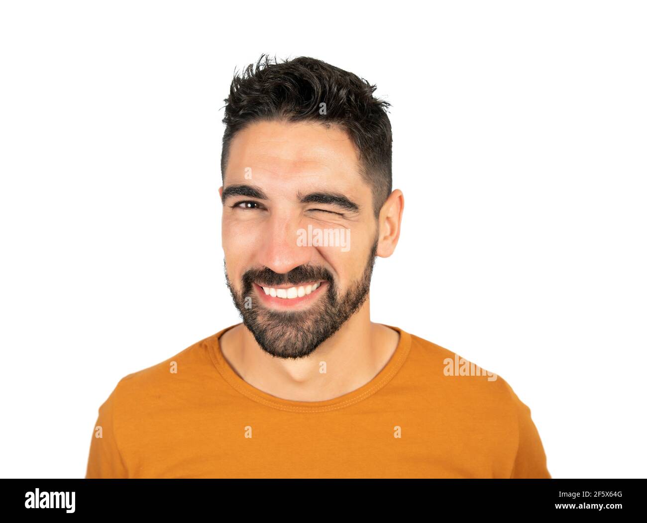 Young man smiling and winking an eye Stock Photo - Alamy