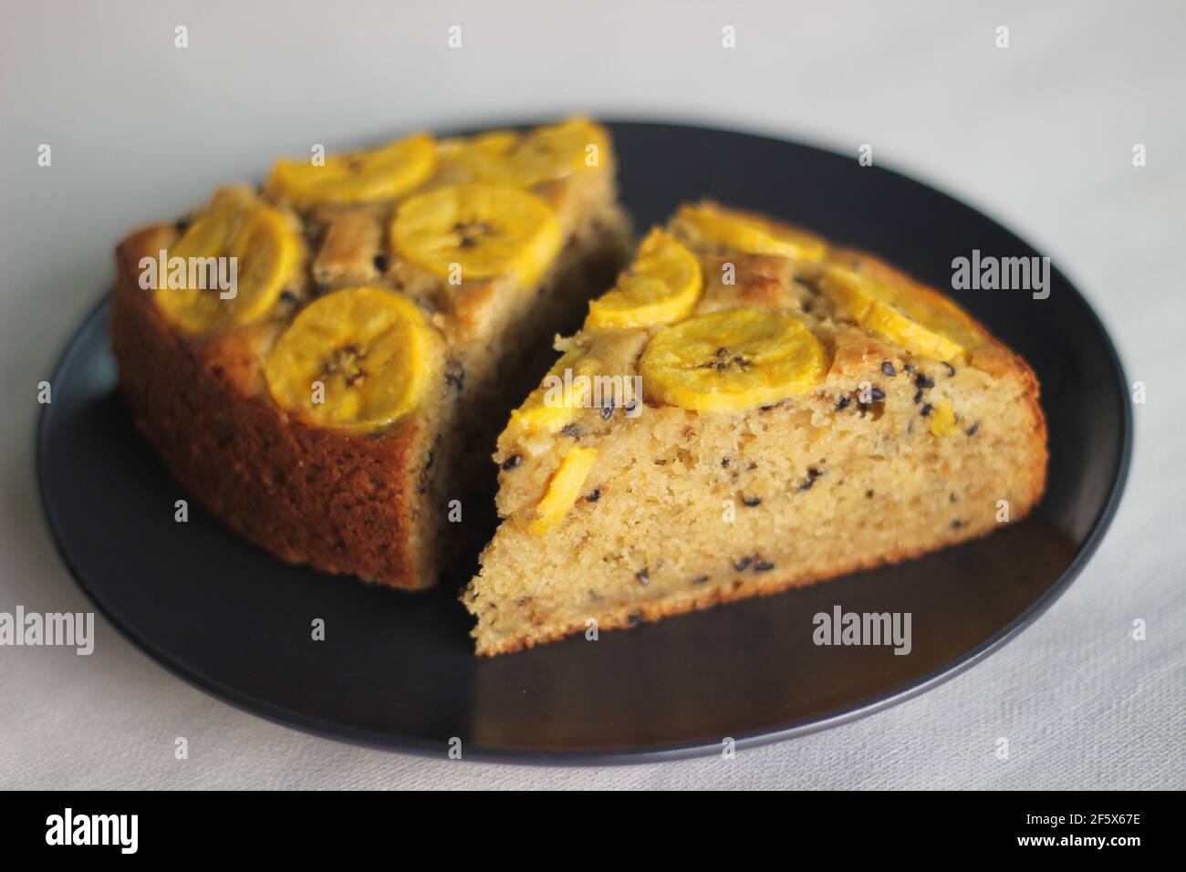 Slices of home baked plantain cake with plantain pieces as a topping ...