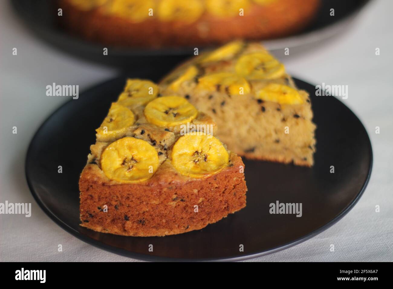 Slices of home baked plantain cake with plantain pieces as a topping ...