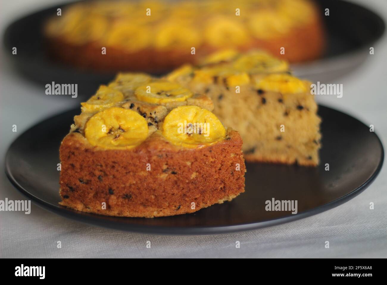 Slices of home baked plantain cake with plantain pieces as a topping ...