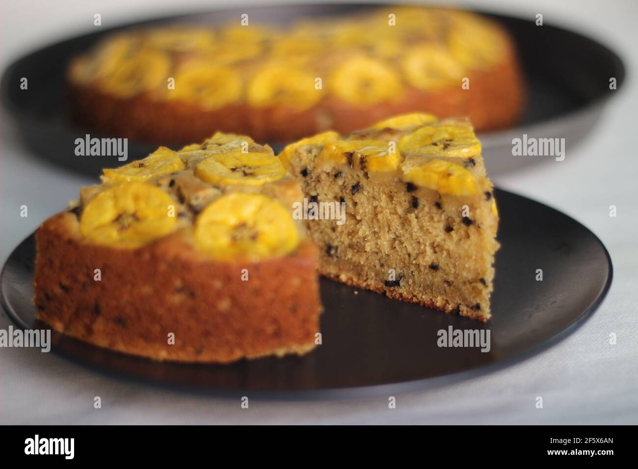 Slices of home baked plantain cake with plantain pieces as a topping ...