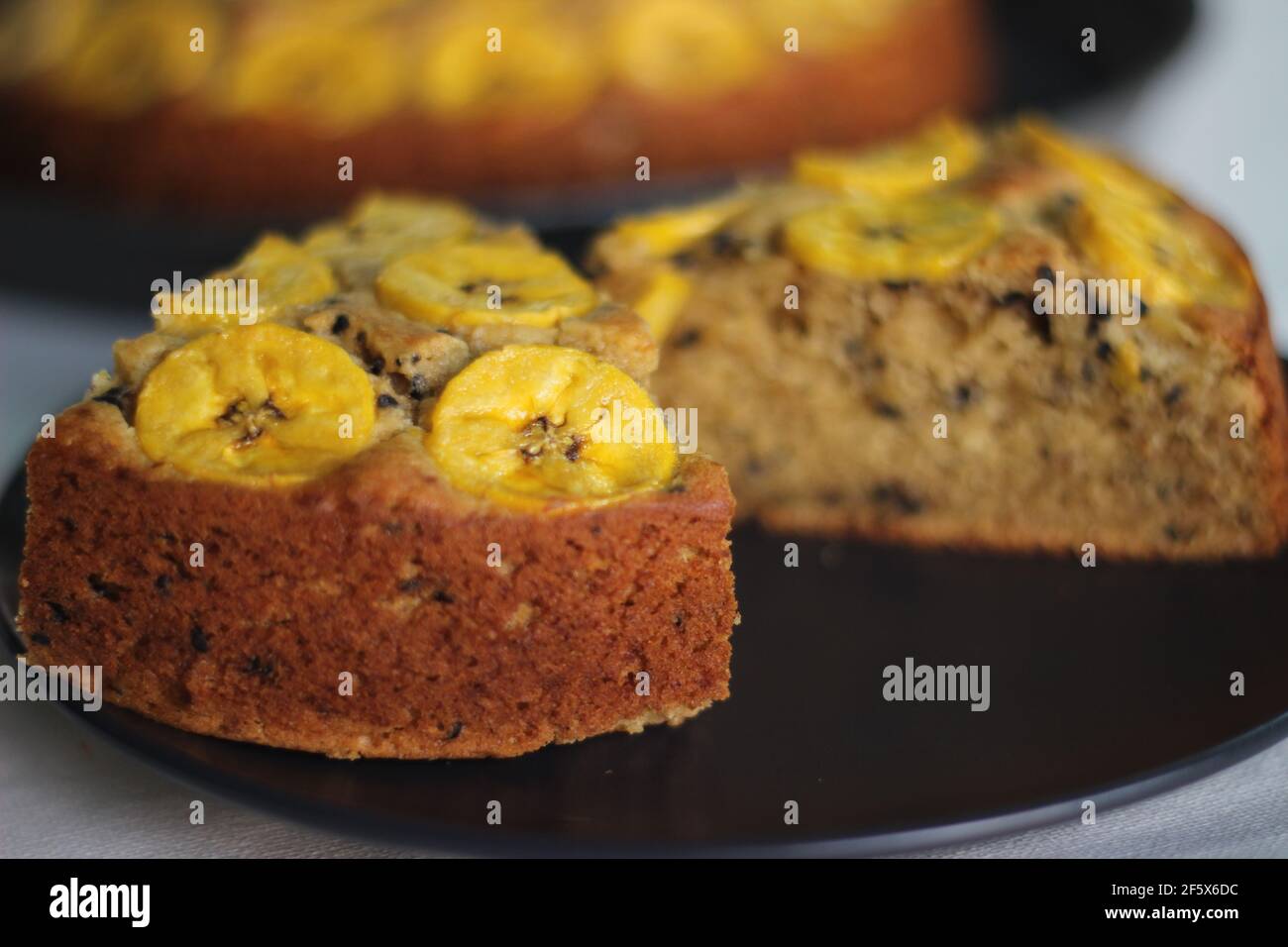 Slices of home baked plantain cake with plantain pieces as a topping ...