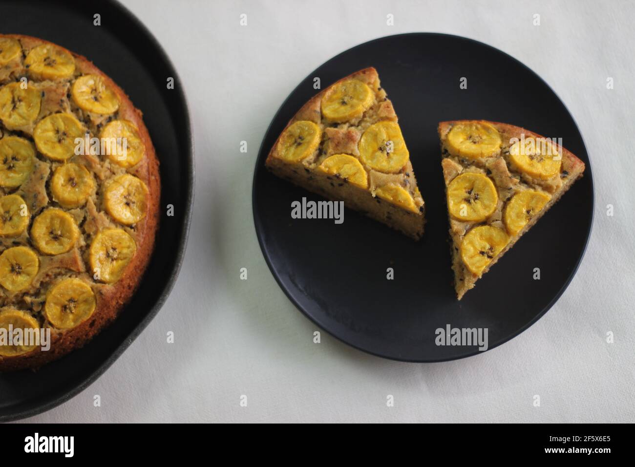 Slices of home baked plantain cake with plantain pieces as a topping ...