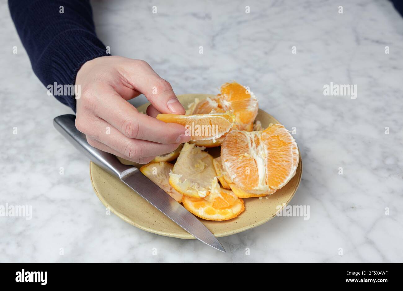 Man's hands peeling an orange. Healthy food concept Stock Photo - Alamy