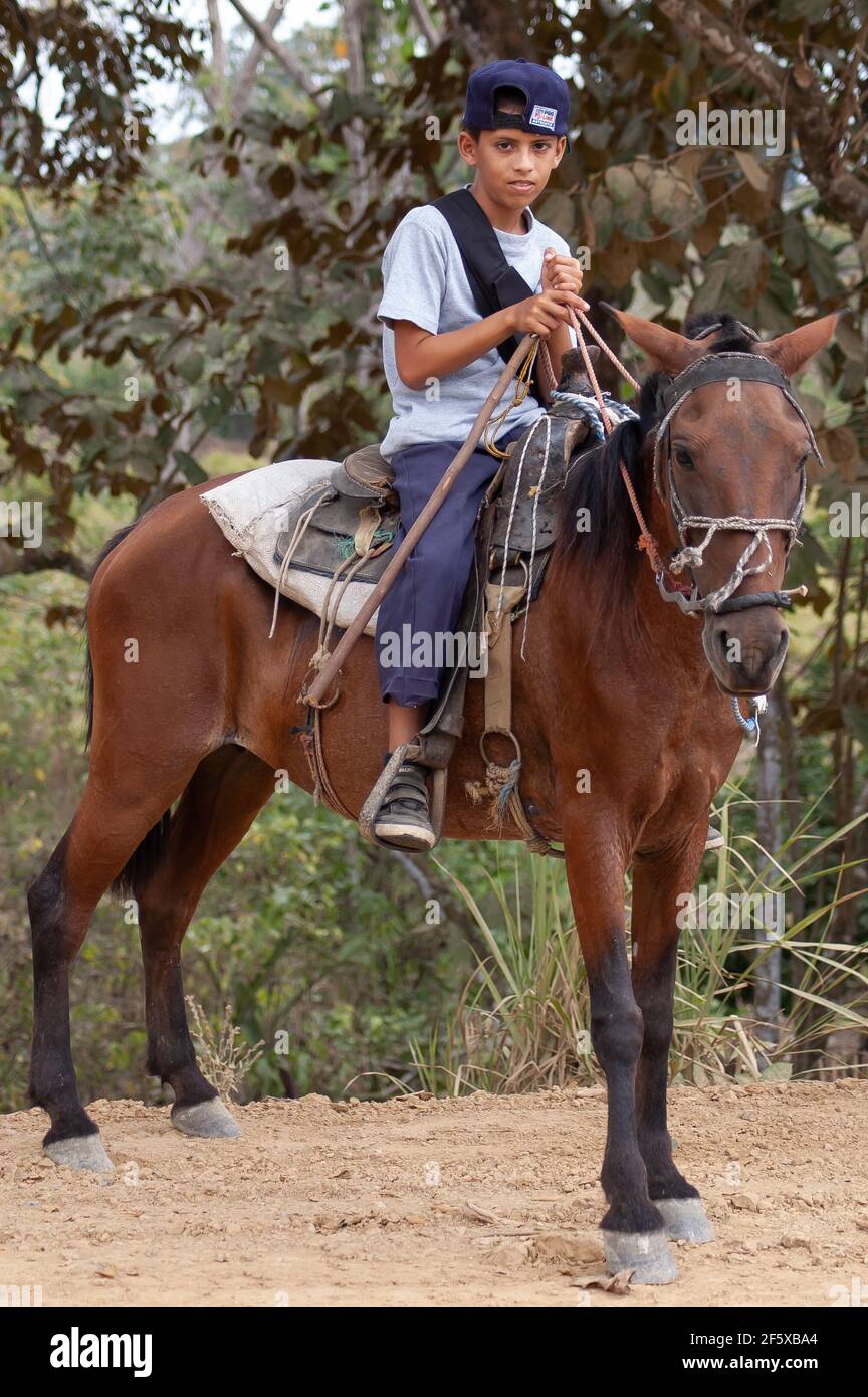 Darien Province, Panama. 07-18-2019. Indigenous boy riding on a horse ...