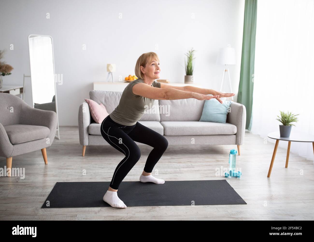 Mature woman squat exercise hi-res stock photography and images - Alamy
