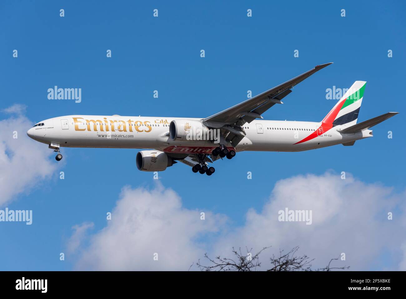 Emirates airline Boeing 777 jet airliner plane A6-EQI on finals to land ...
