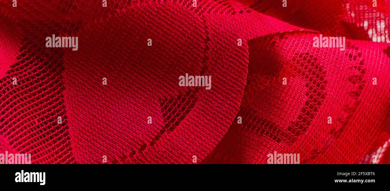 A luxurious red mesh fabric, useful for backgrounds. Red fabric mesh in ...