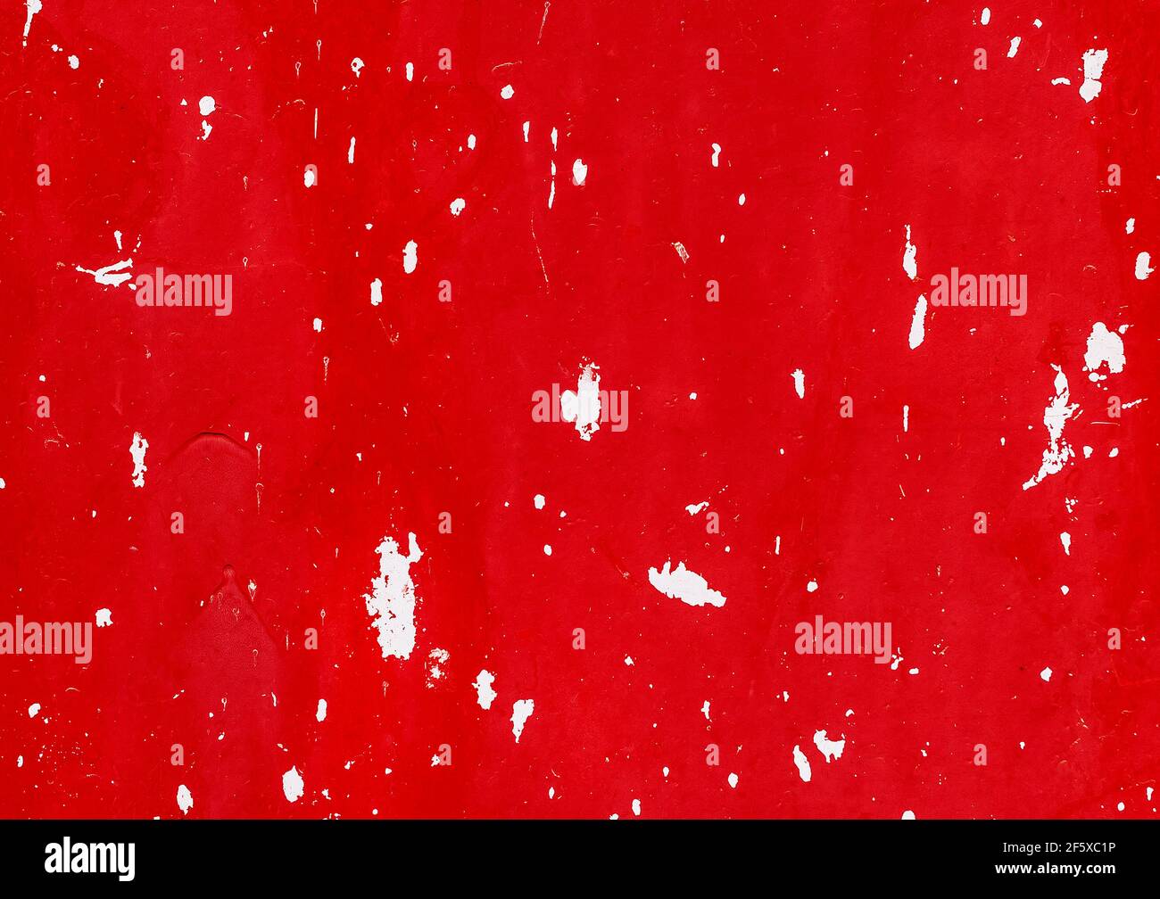 Splashes of white paint on a red cherry surface wall texture background ...
