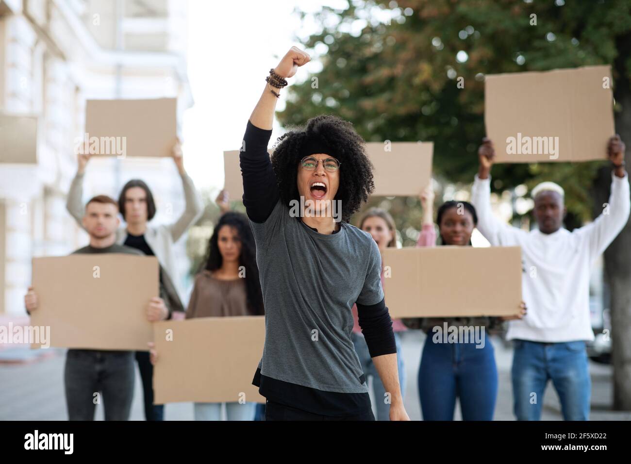 Guy leading international group of students strikers with blank ...