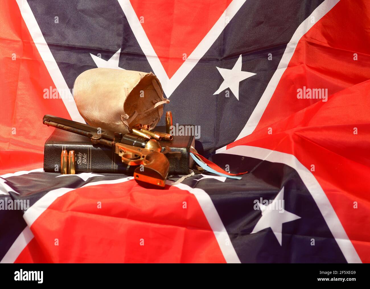 The Holy Bible, bull scrotum, bullets, and revolver on the rebel flag ...