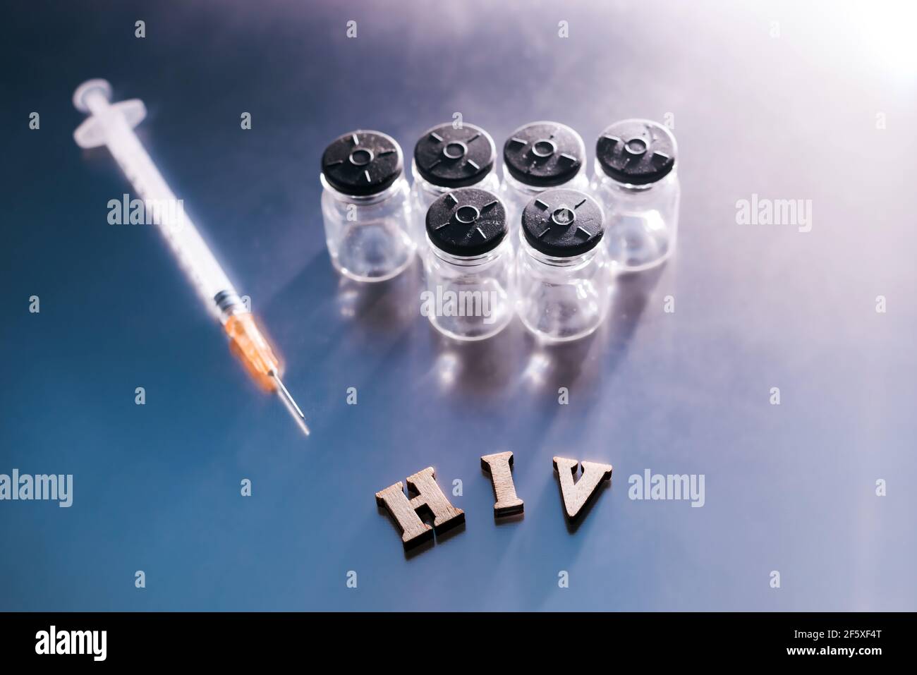 New AIDS treatment, vaccination with syringe with new vaccine, letters ...