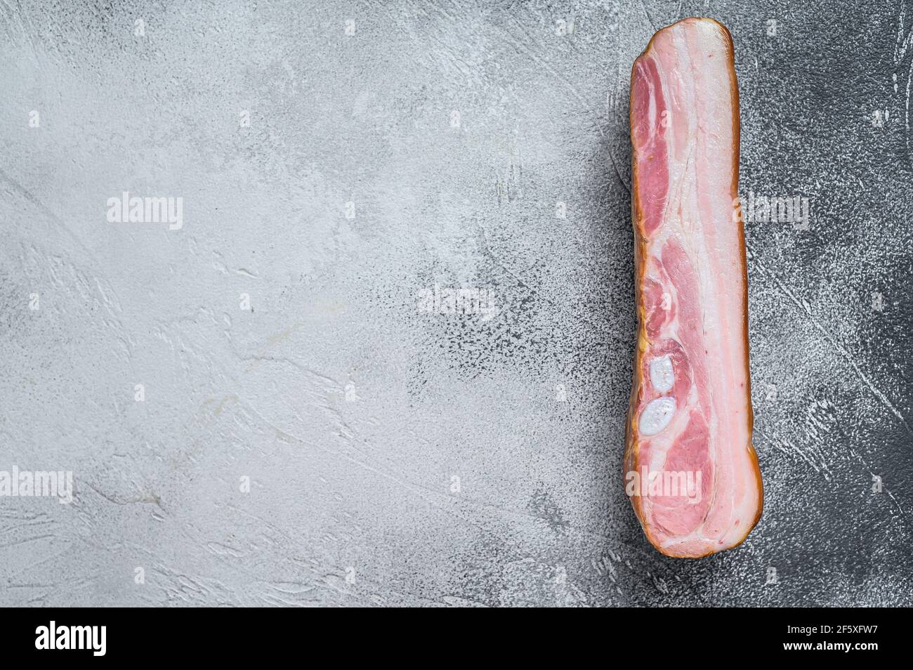 Fresh pork belly bacon block. White background. Top view. Copy space ...