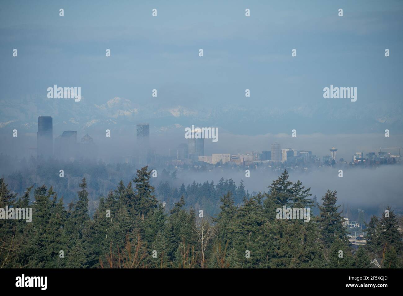 Seattle skyline covered with morning fog on sunny day Stock Photo - Alamy