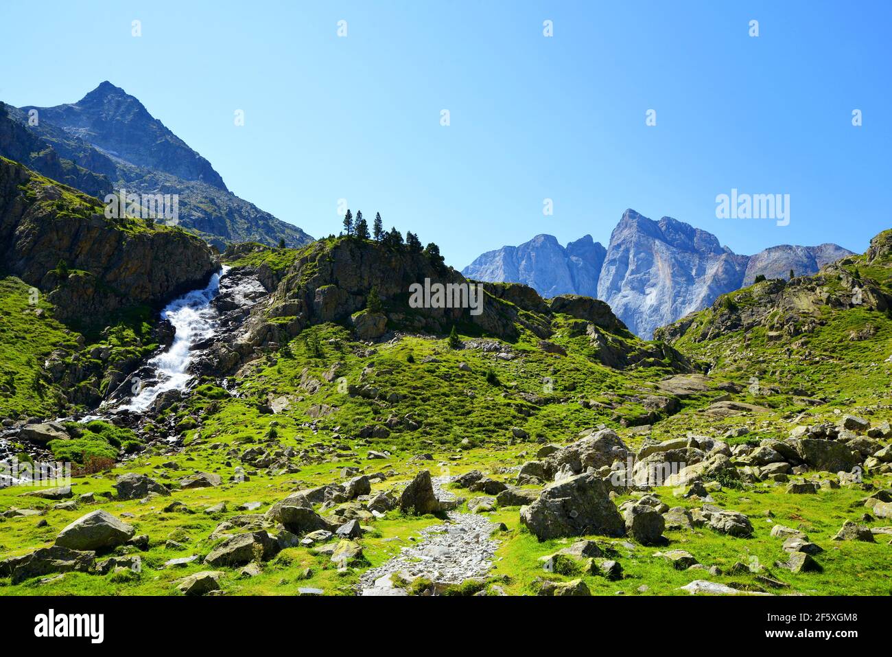 Waterfall with mountain Vignemale at the background. National park ...