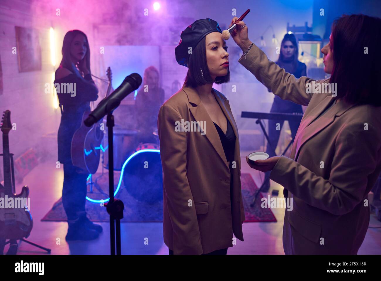 Singer performance standing guitar microphone holding illuminated hi ...