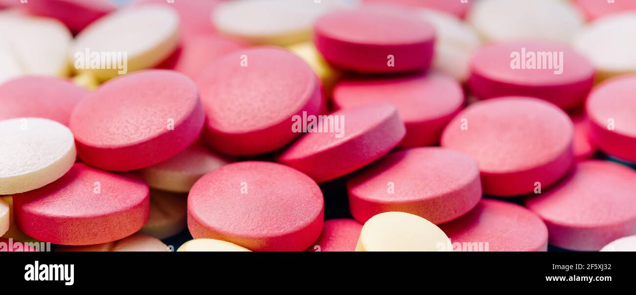 Pills close-up pink and yellow. Medical devices. Close-up of pills ...