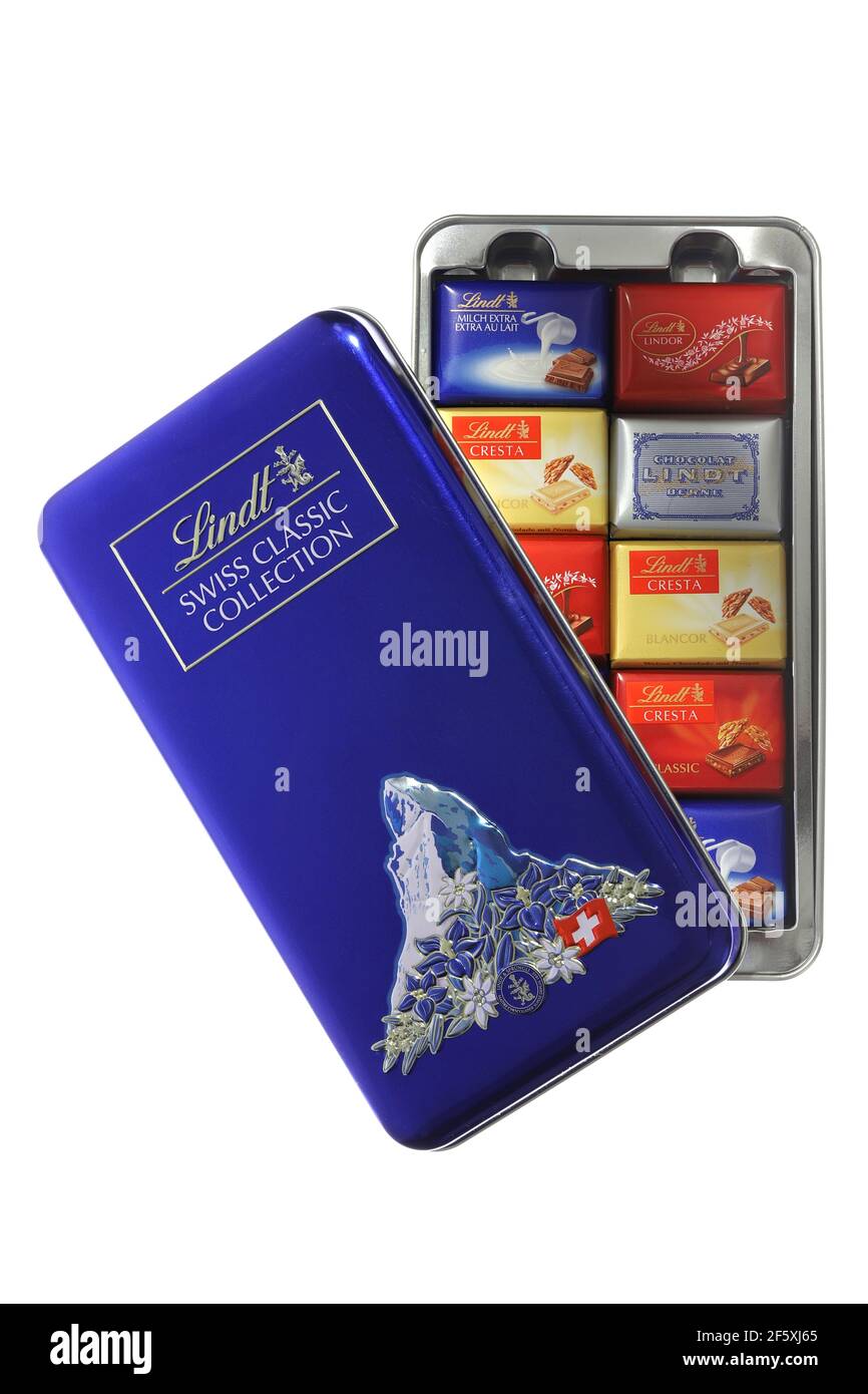 metal box with various Lindt chocolate bars isolated on white ...