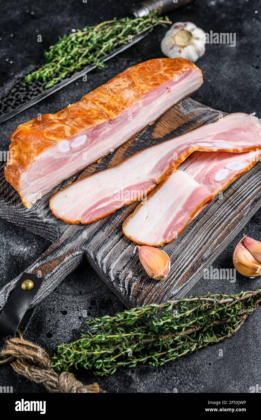 Smoked pork belly bacon block. Black background. Top view Stock Photo ...