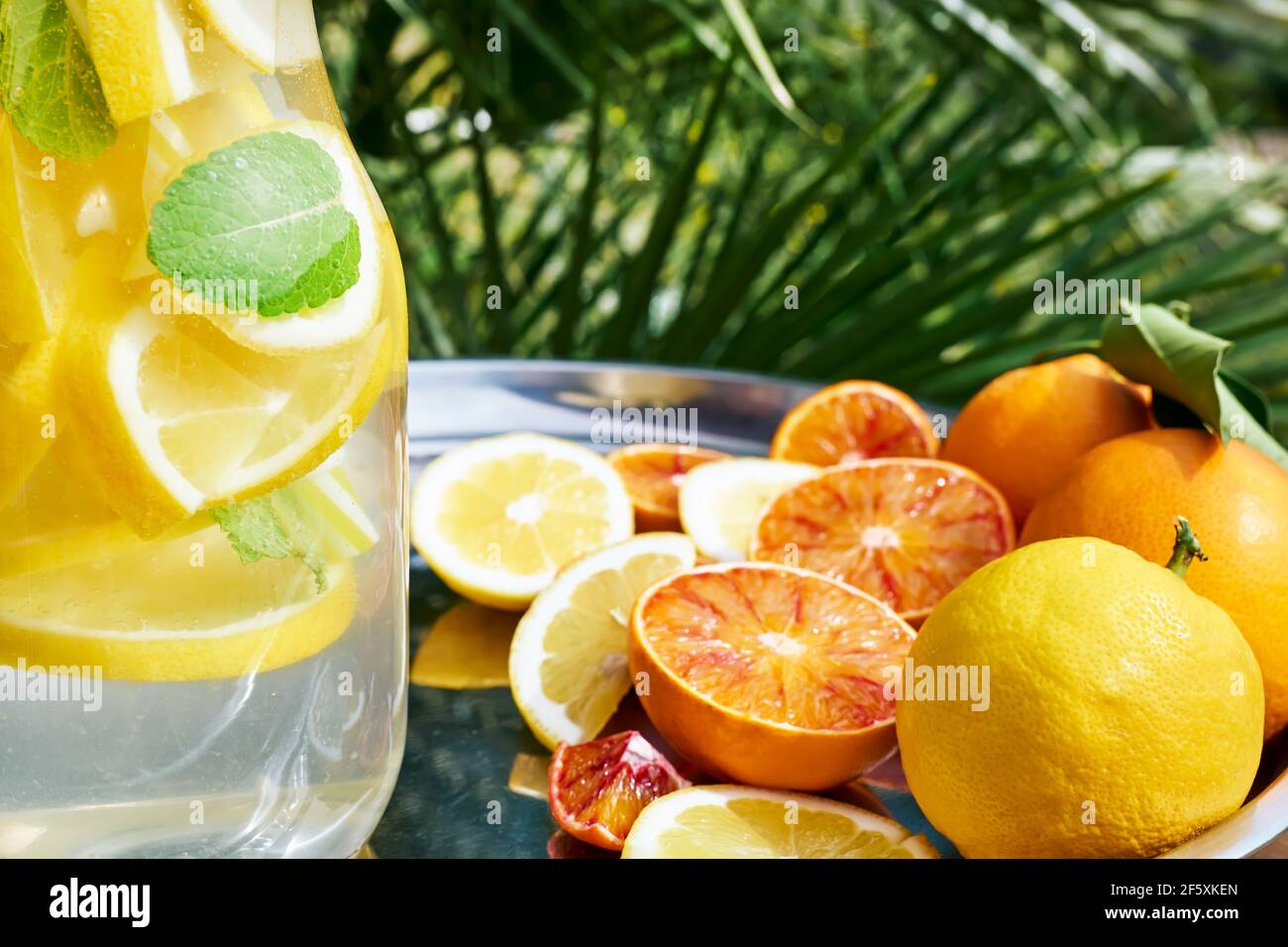 Summer refresh lemon cocktail with ice and ripe bio citrus fuits on ...