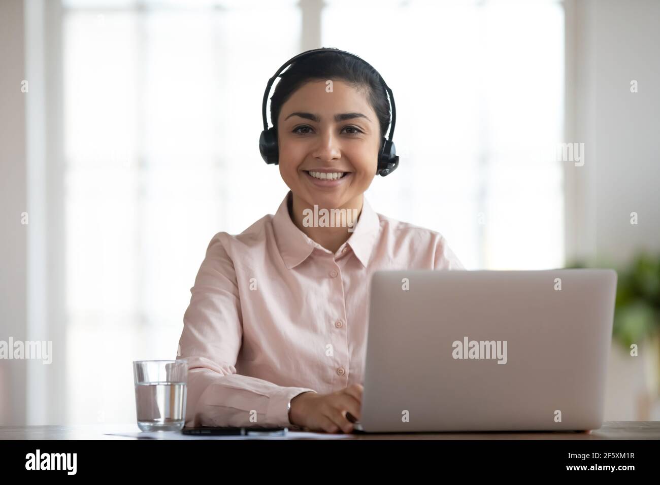Portrait of smiling Indian female employee at workplace Stock Photo - Alamy