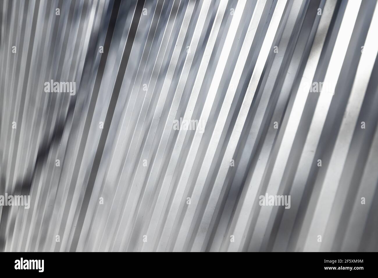 Corrugated shiny metal wall with shadows, background photo texture ...