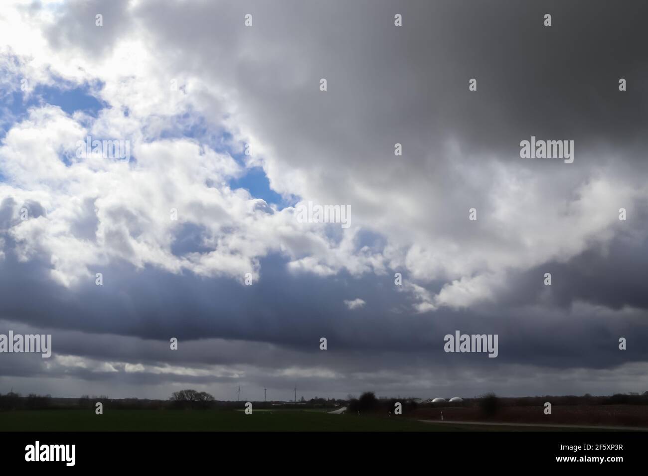 Beautiful clouds in a dark sky over a northern european landscape Stock ...