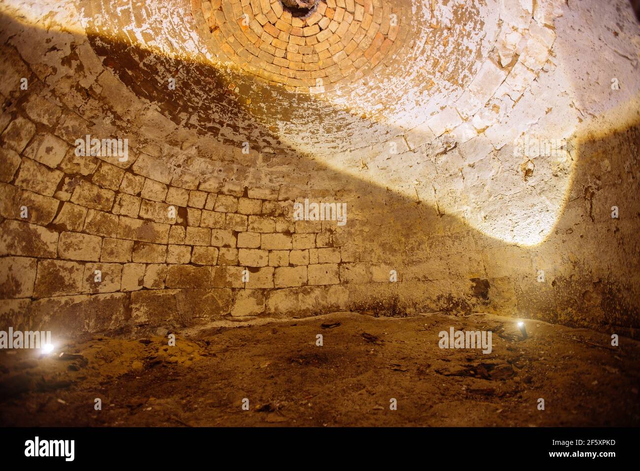 Abandoned empty old underground round cellar under rural house Stock ...