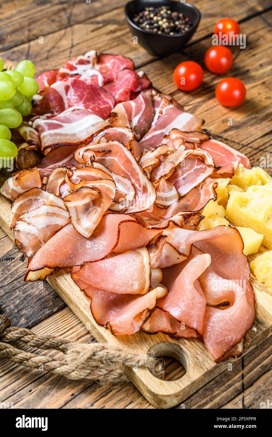 Set of cold cured italian meat Ham, prosciutto, pancetta, bacon with ...