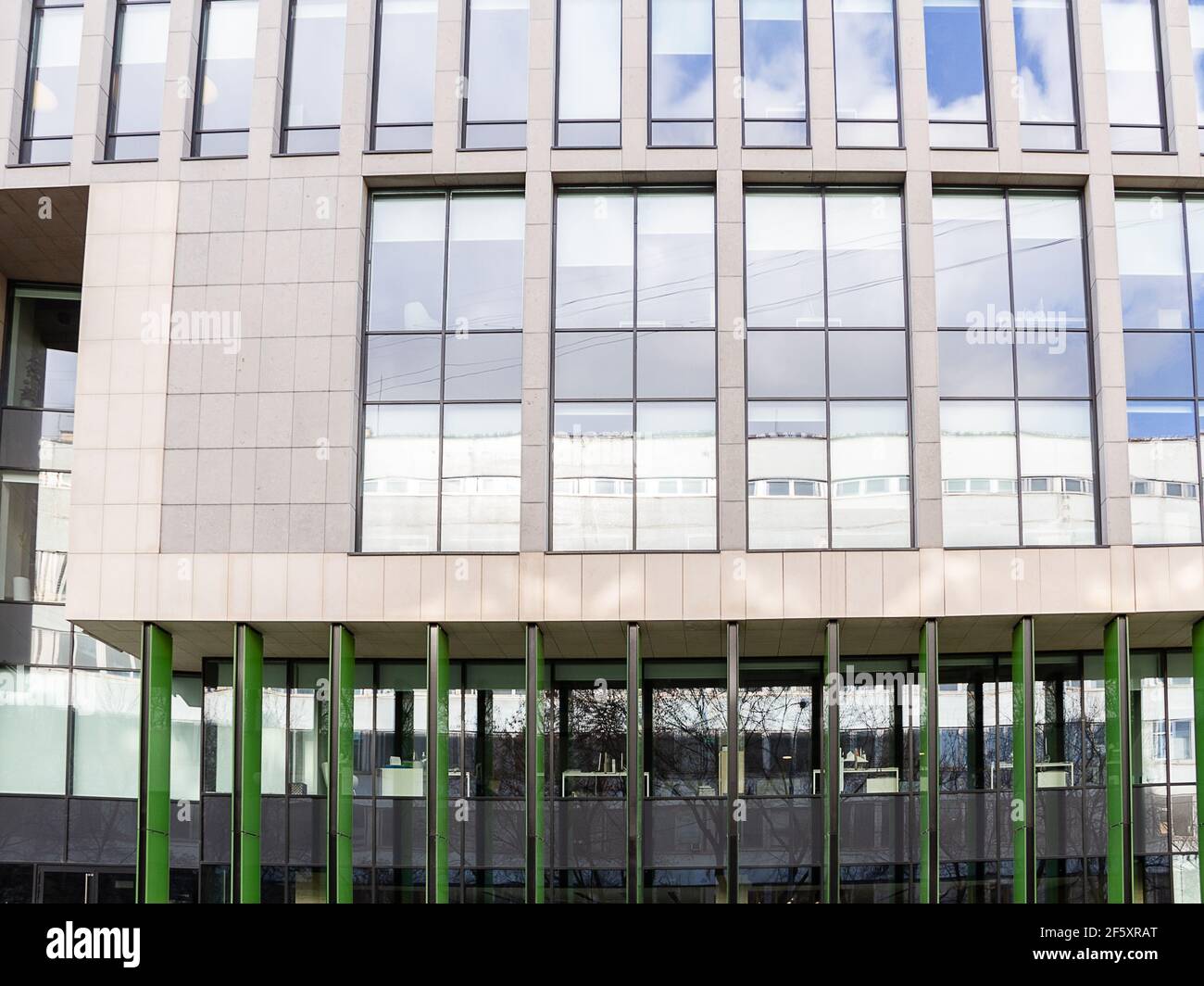Office building windows early spring. Reflections in large windows ...