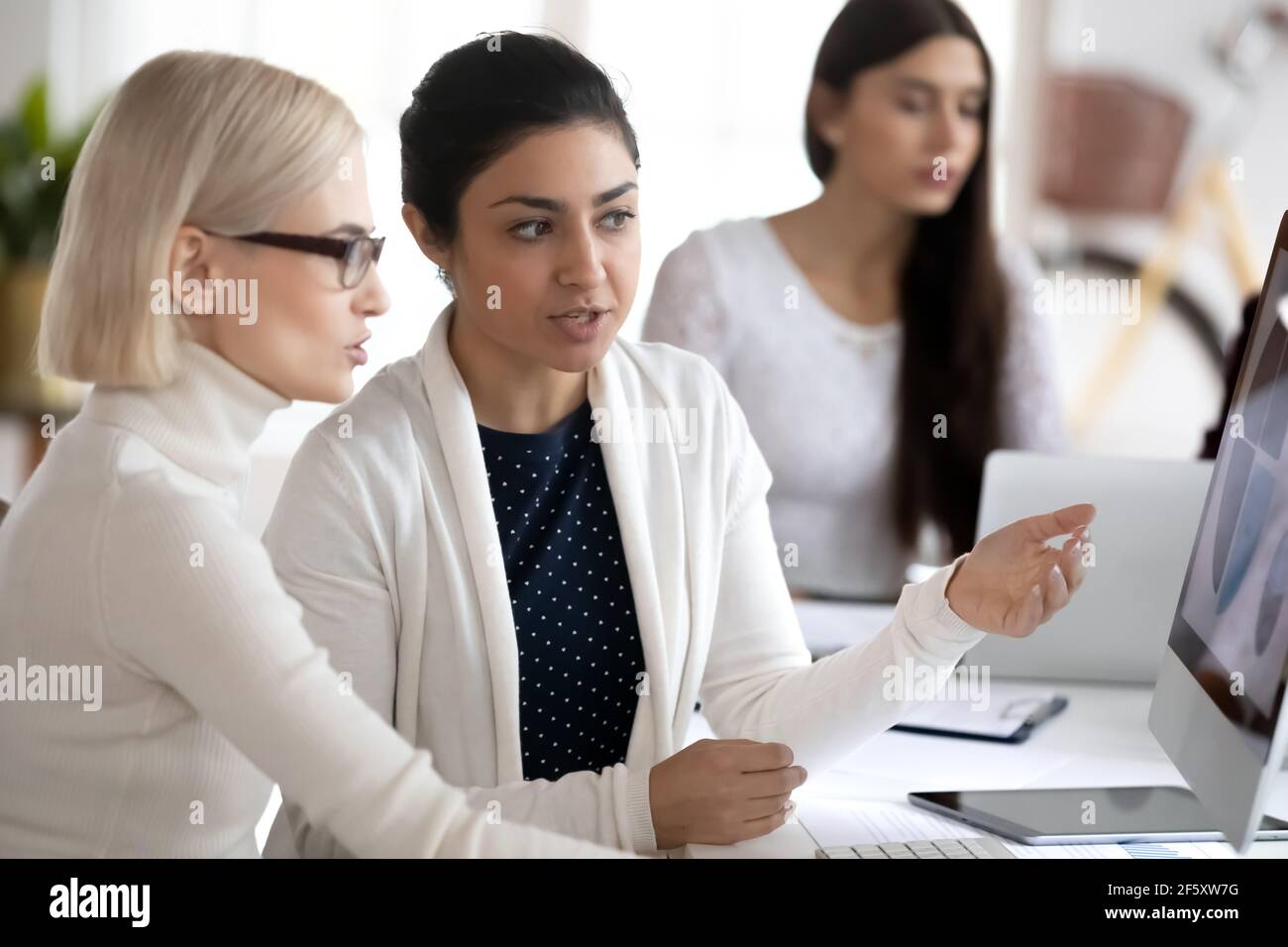 Diverse multiethnic businesspeople cooperate hi-res stock photography ...