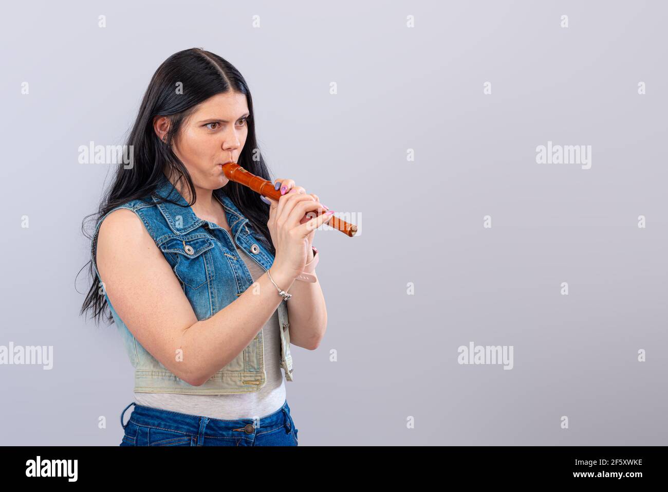 Standing flute player hi-res stock photography and images - Alamy