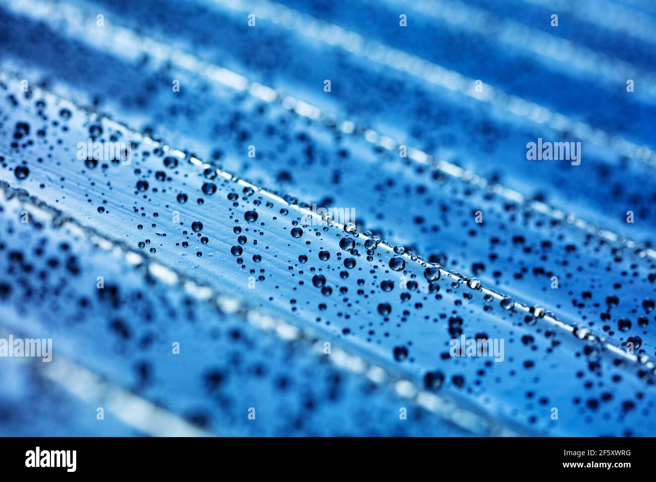 Drops of water on curvy roof surface after rain Stock Photo - Alamy