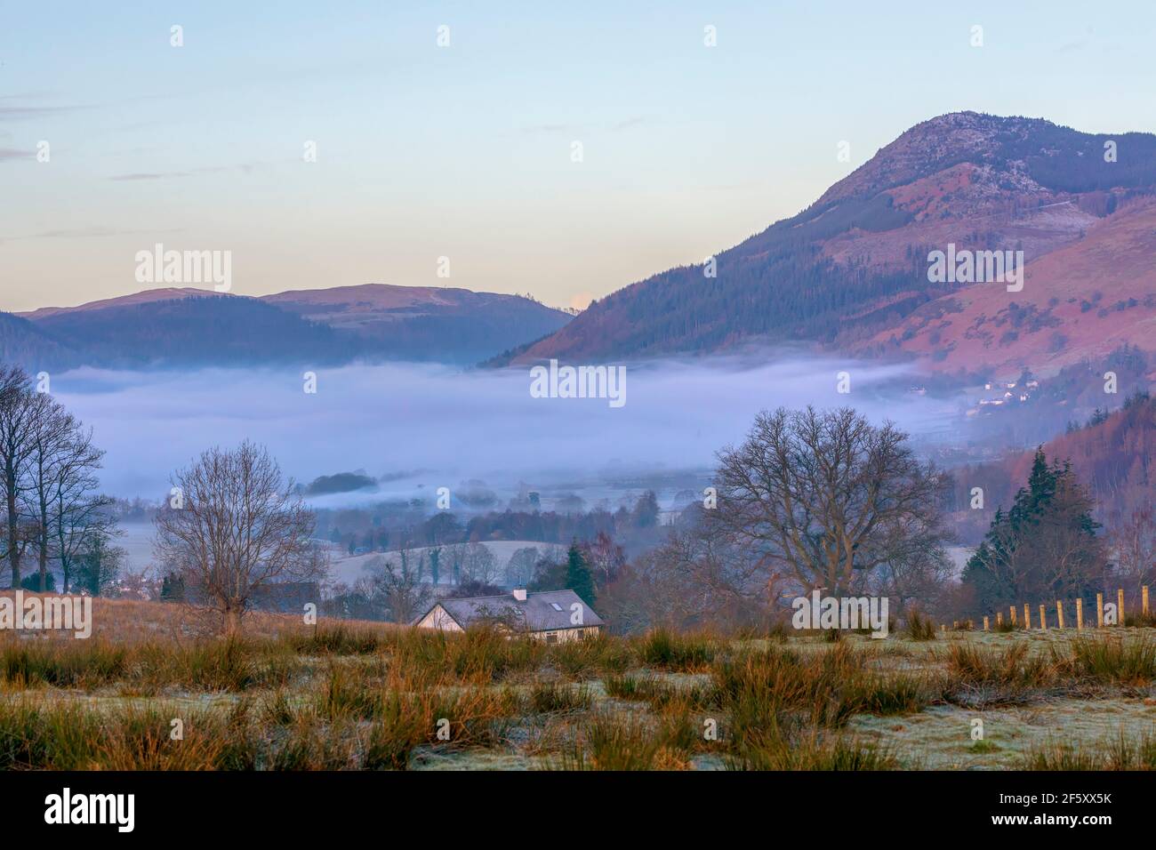 Bassenthwaite Lake is covered by a fog inversion on a winter morning ...