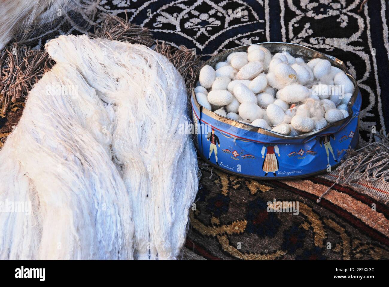 White Raw Silk Thread and cocoons for sale Stock Photo - Alamy